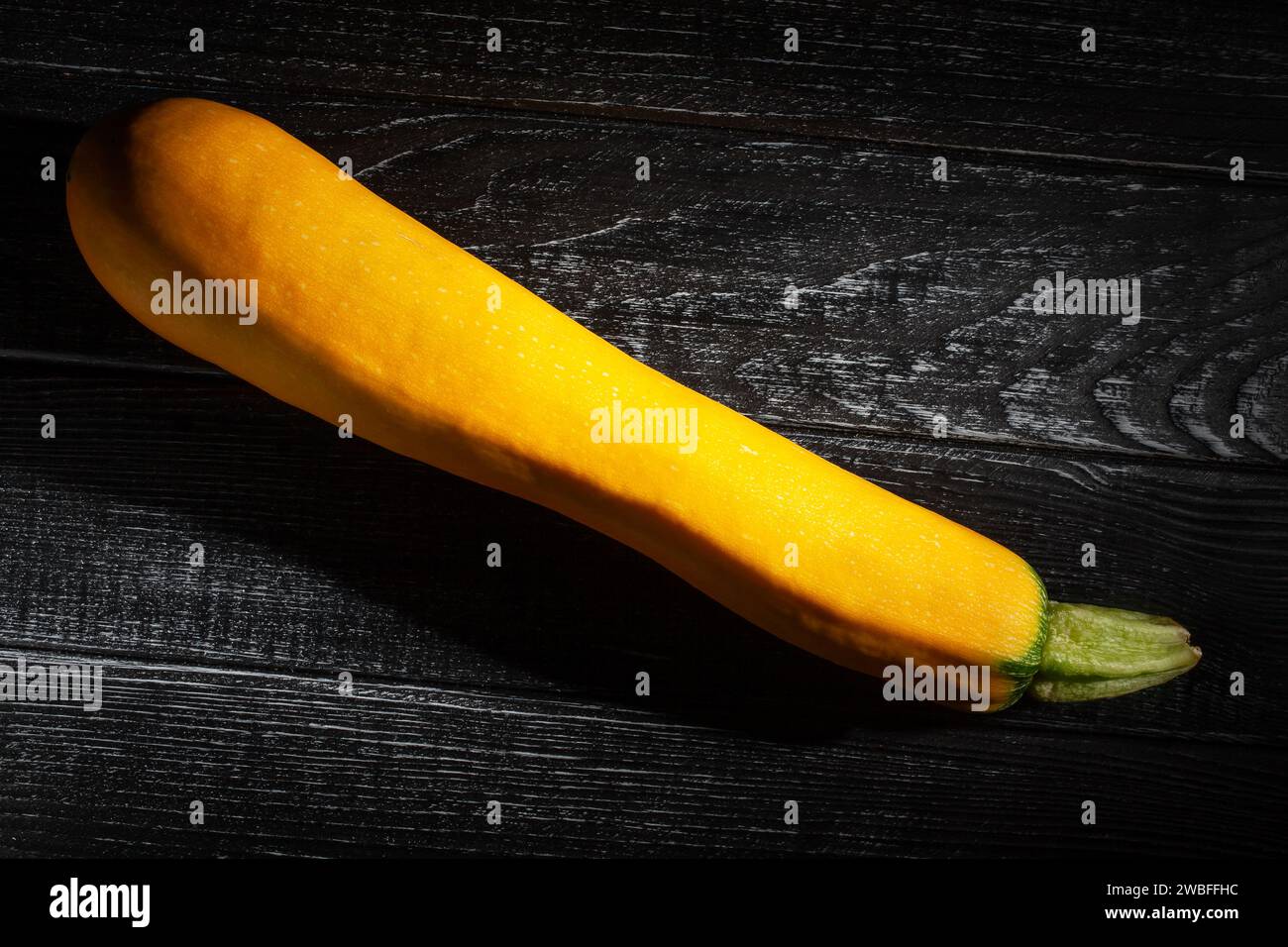 yellow marrow on wood background Stock Photo - Alamy