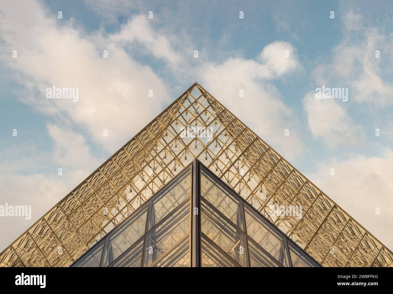 France, Paris - Jan 03, 2024 - Geometrical forms of Glass pyramid with ...