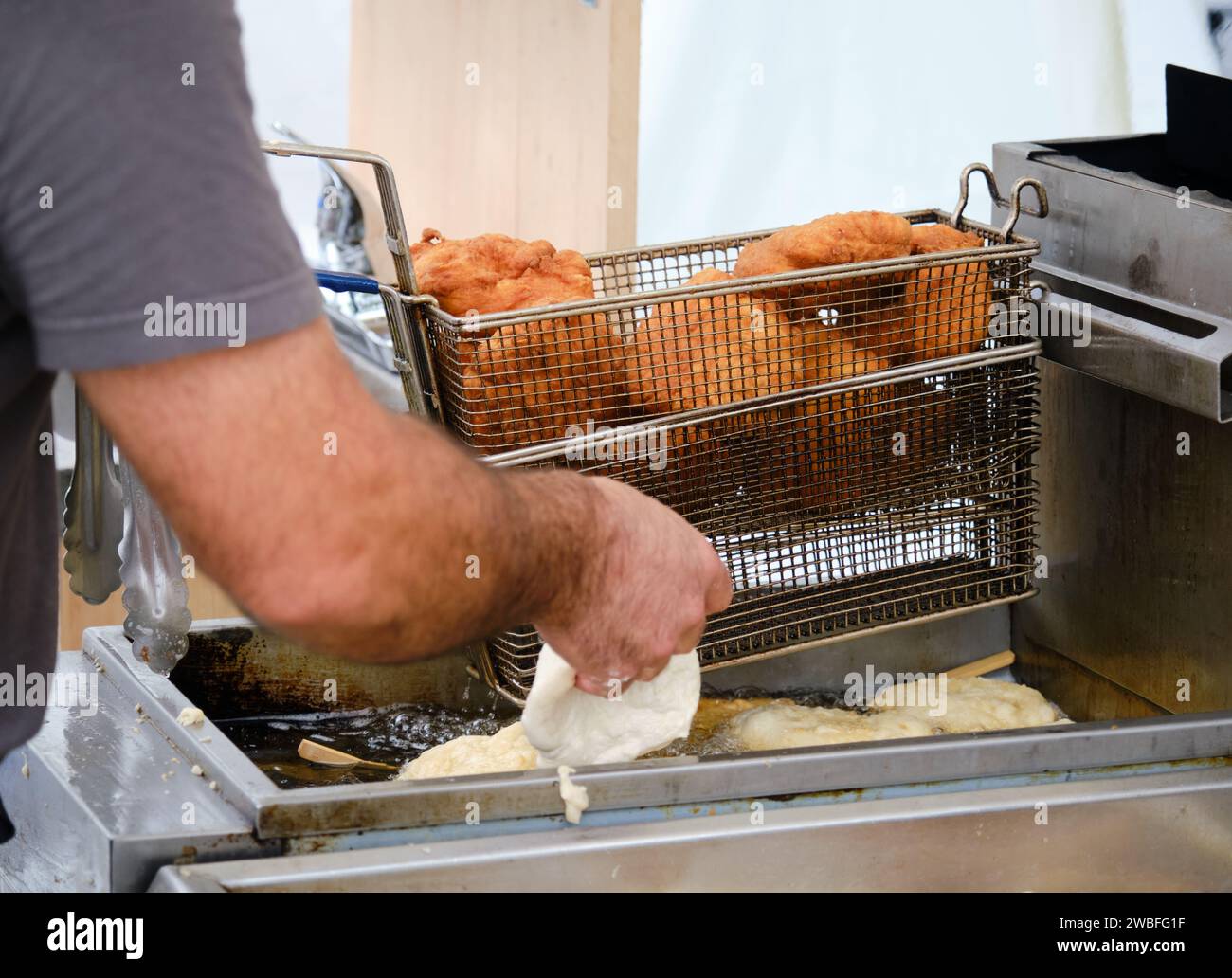 Frying up bannock in oil fryer at aboriginal food festival, Halifax ...