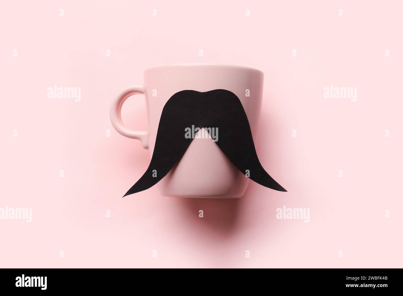 Cup with paper mustache on pink background Stock Photo - Alamy