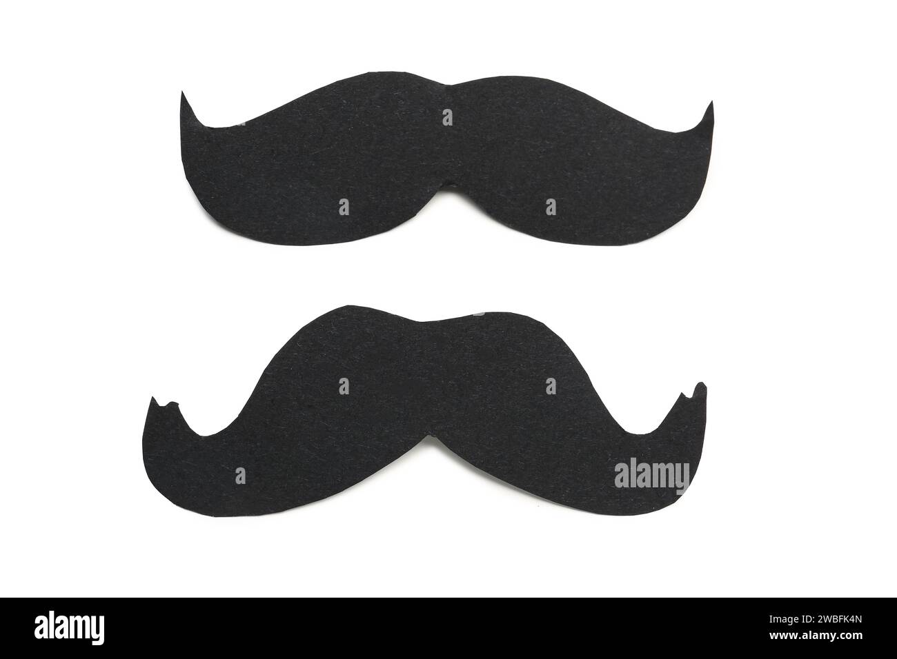 Paper mustaches on white background Stock Photo - Alamy