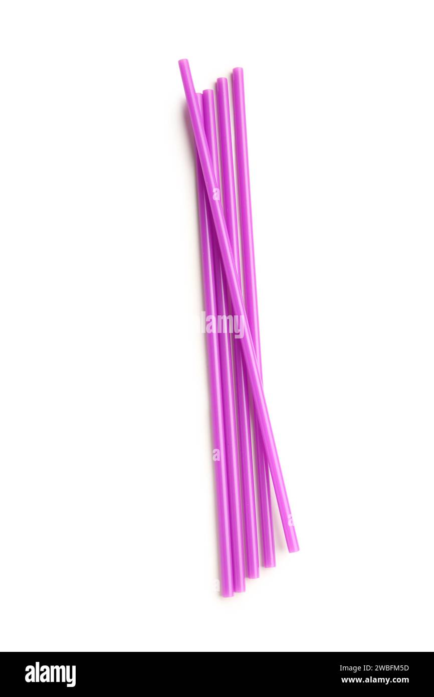 Purple plastic straws on white background Stock Photo - Alamy