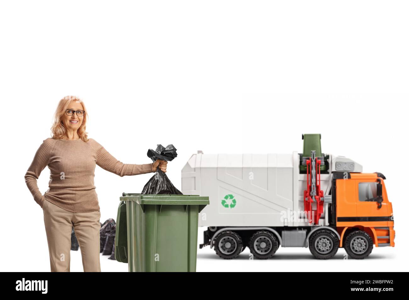 Woman in front of a garabe truck throwing a waste bag in a bin isolated ...