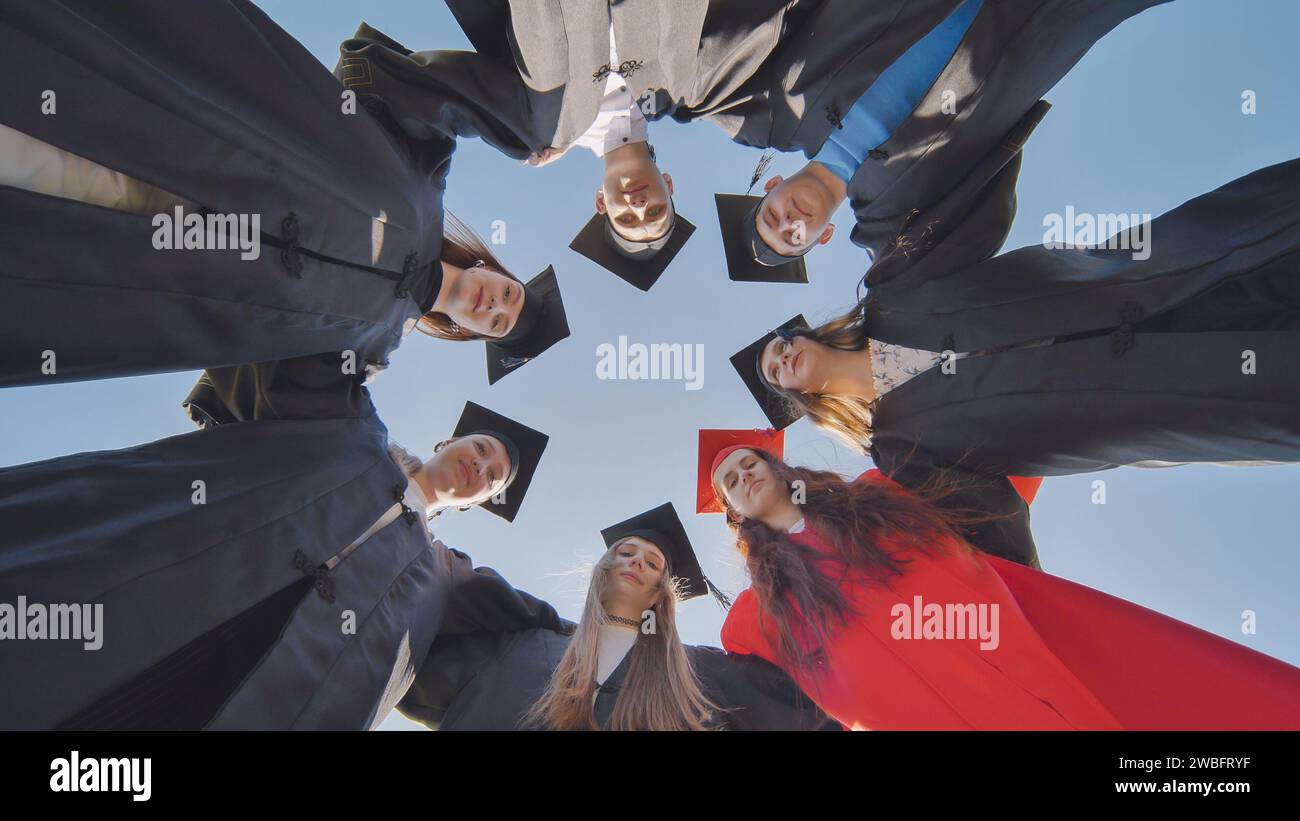 Graduate hugging parents hi-res stock photography and images - Alamy