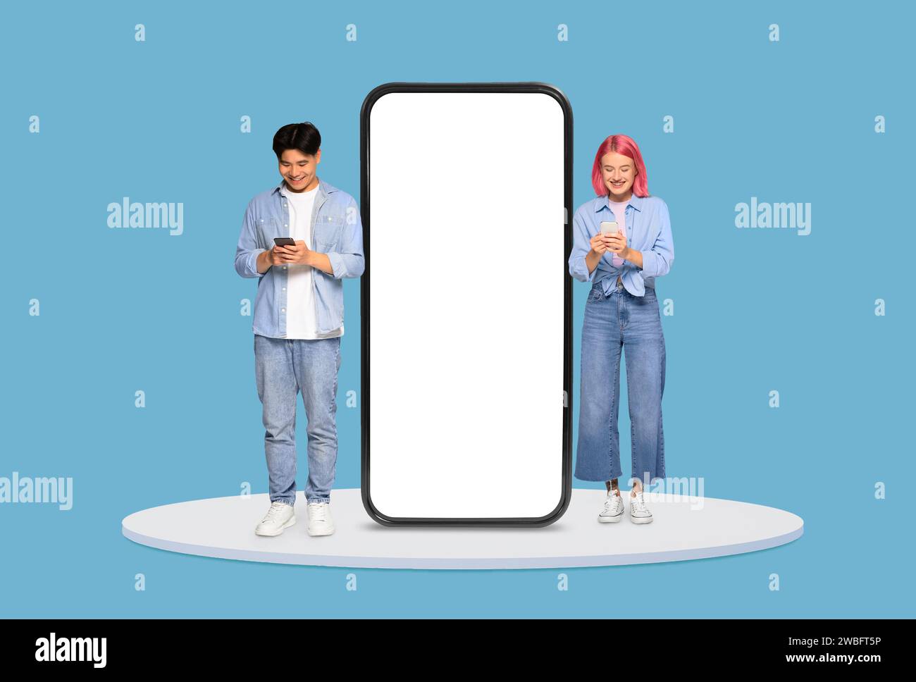 Youth texting by big smartphone display, light blue background Stock ...