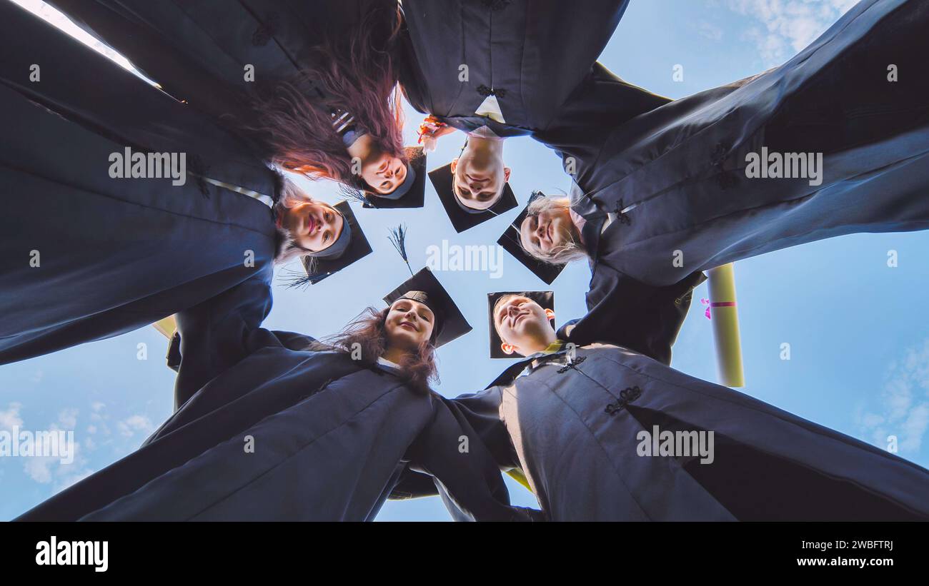 College students stand in a circle wearing black robes Stock Photo - Alamy
