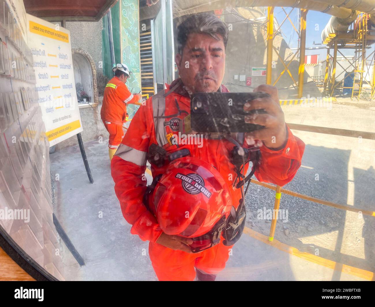 Photographer Luis Gutierrez makes a self-portrait of a miner with an ...
