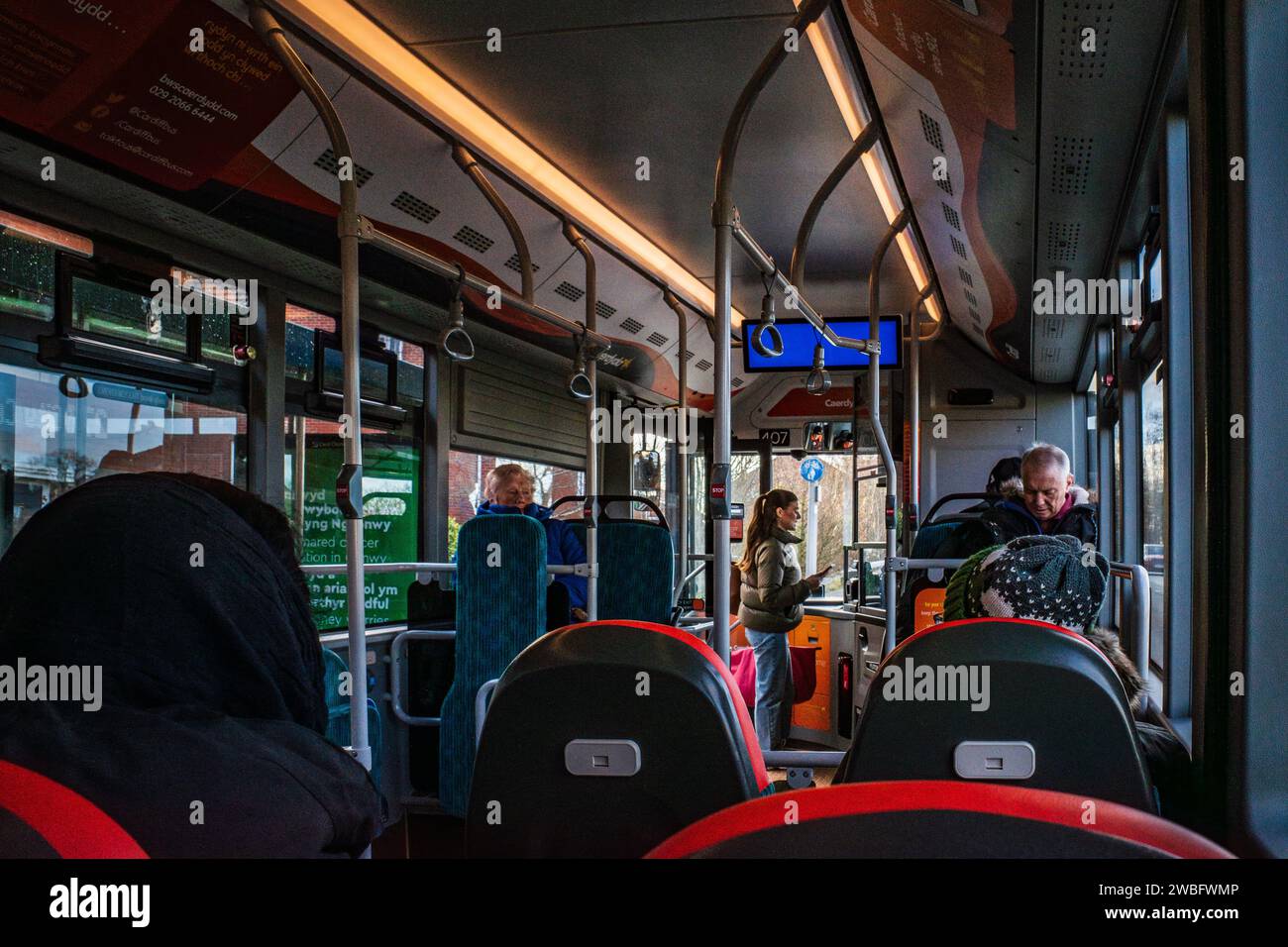 View from inside a Bus on a city route - Bus interior with passengers and someone buying a ...