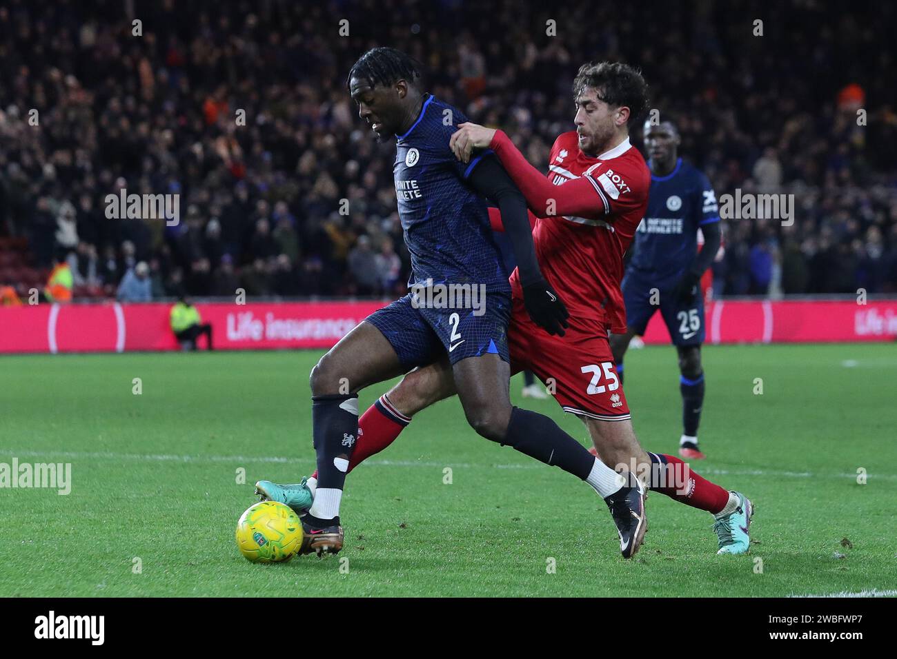 Matt Crooks of Middlesbrough battles for possession with Chelsea's Axel ...