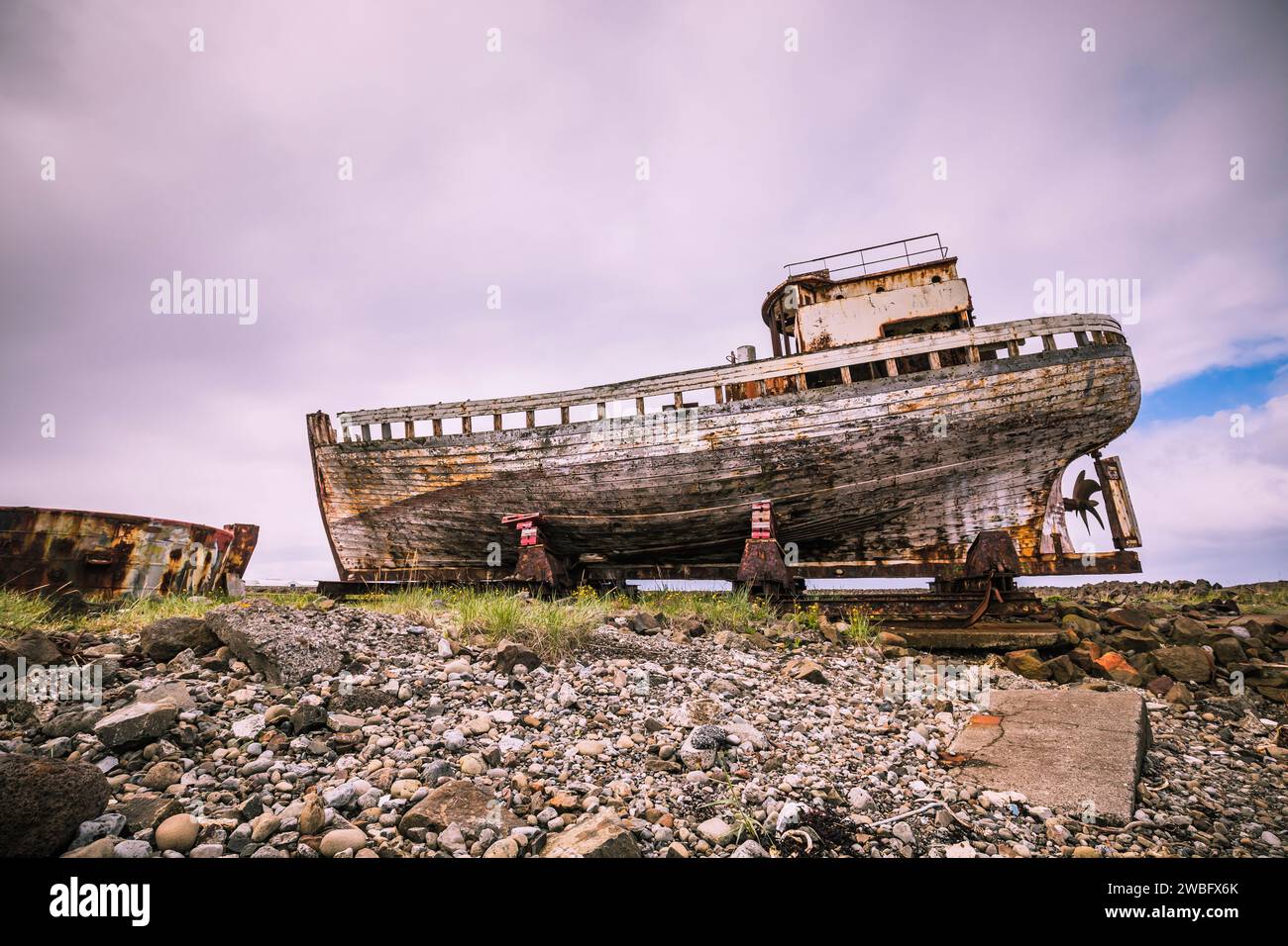 Fishing trawler at the rocks in Olafsvik Stock Photo - Alamy
