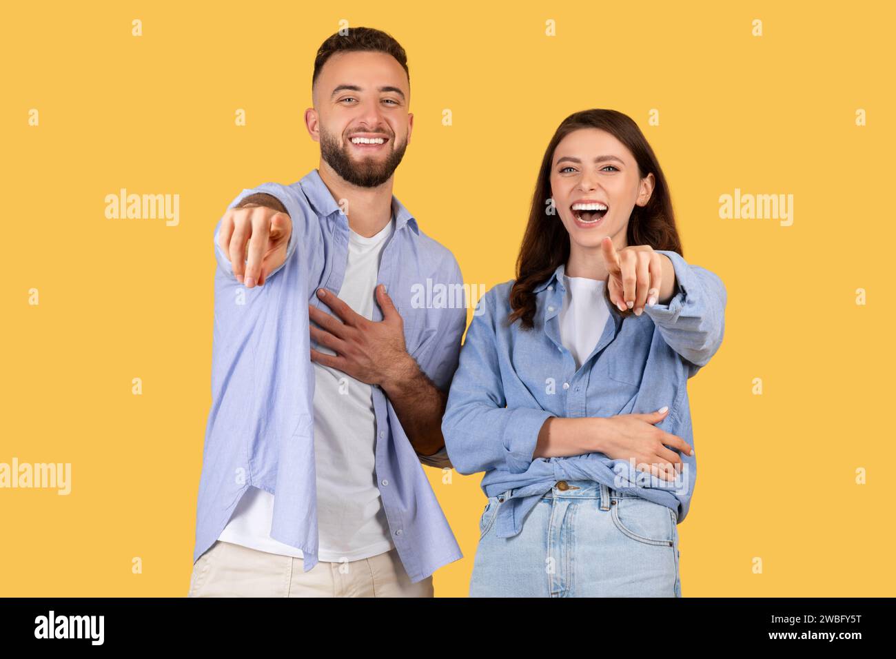 Playful young man pointing viewer hi-res stock photography and images ...