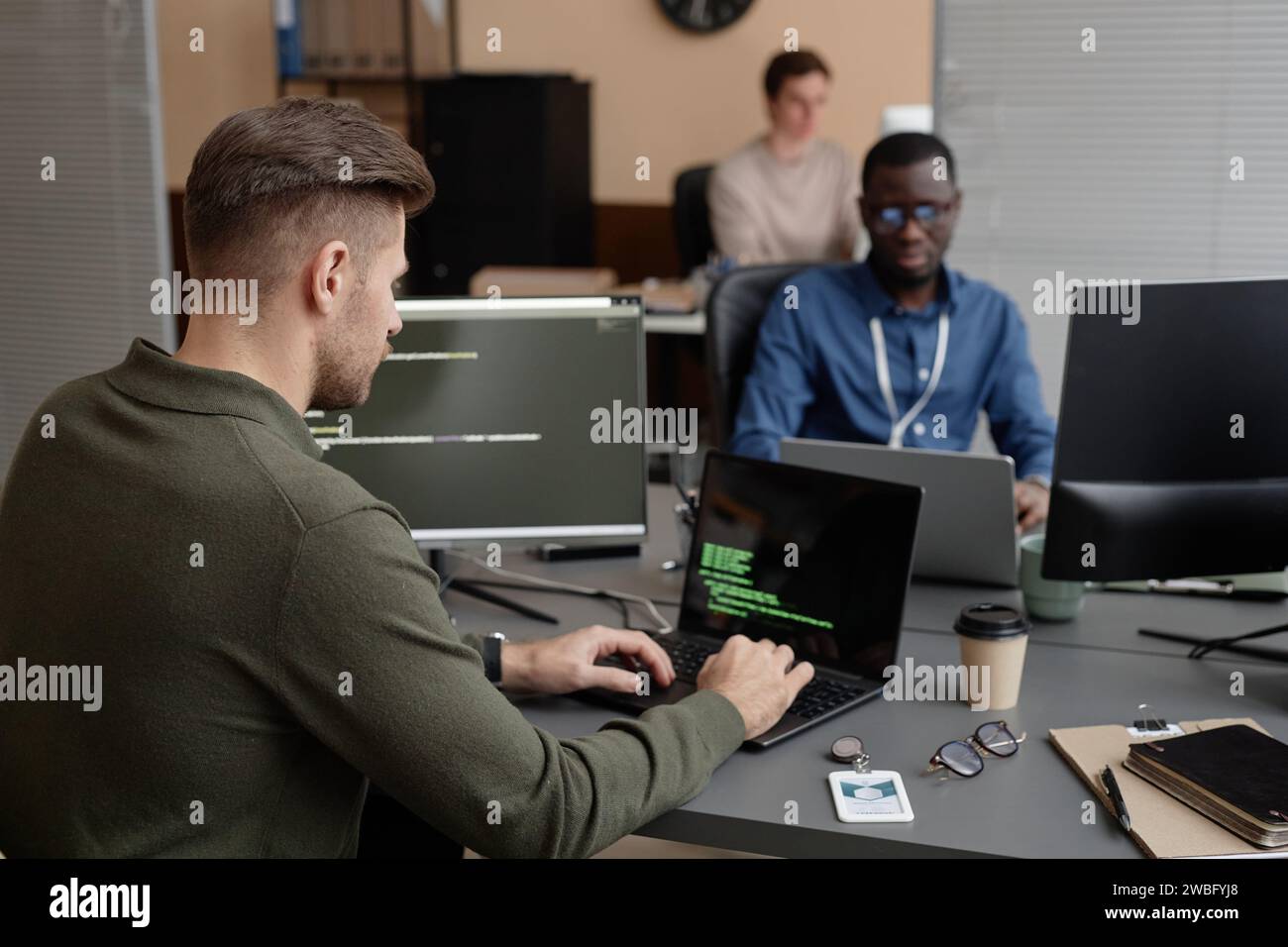 Cybersecurity Developer Working on Laptop Stock Photo - Alamy