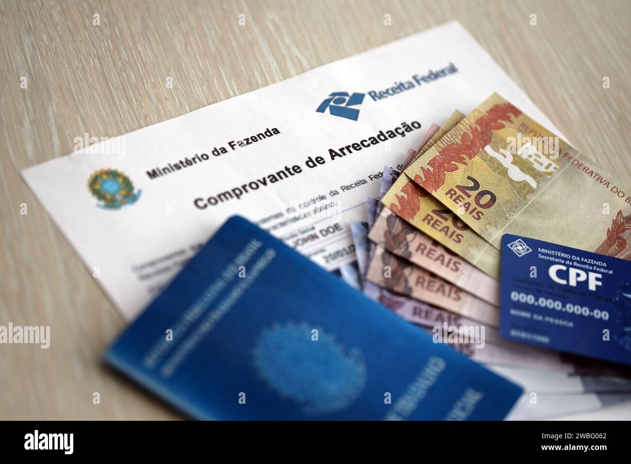 TERNOPIL, UKRAINE - JULY 7, 2023 Brazilian Work Permit document and ...