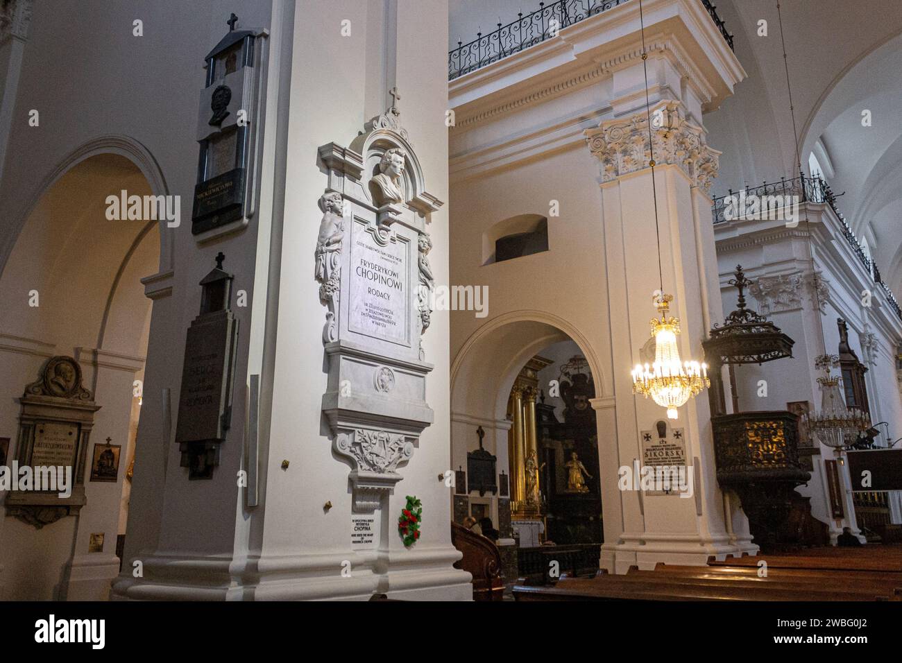Warsaw, Poland. Funerary monument on a pillar in Holy Cross Church ...