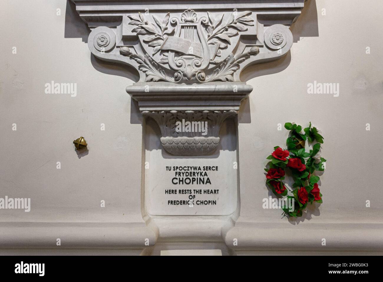 Warsaw, Poland. Funerary monument on a pillar in Holy Cross Church ...