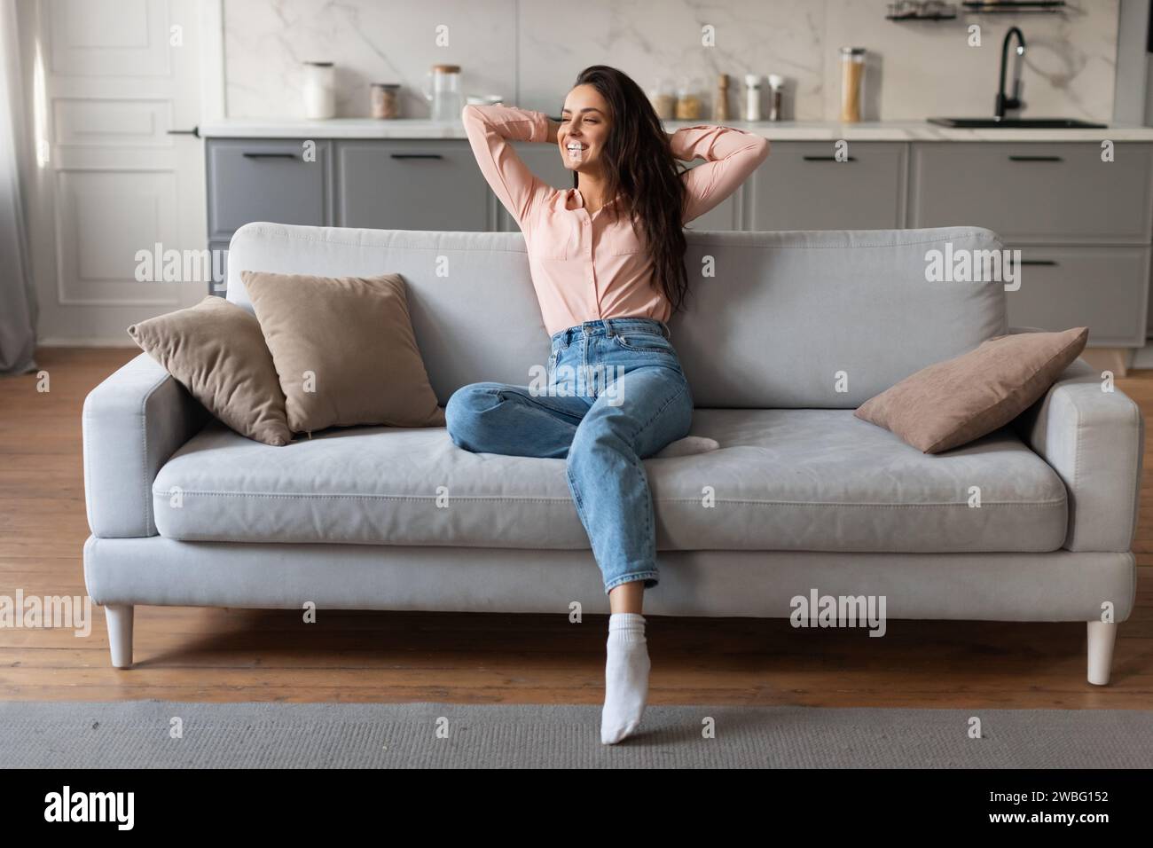 Relaxed woman laid on couch hi-res stock photography and images - Alamy