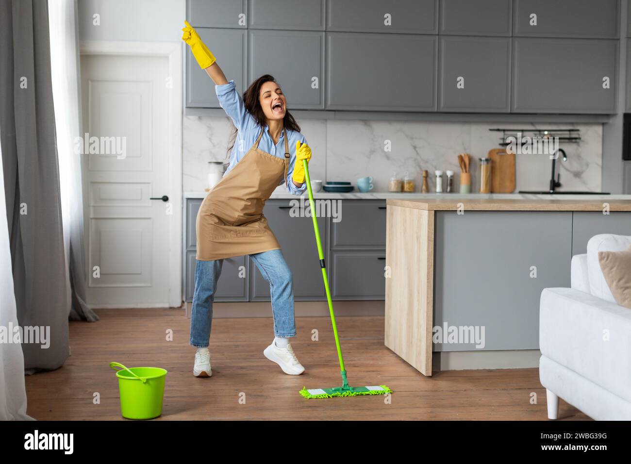 Cleaning lady mop apron hi-res stock photography and images - Alamy