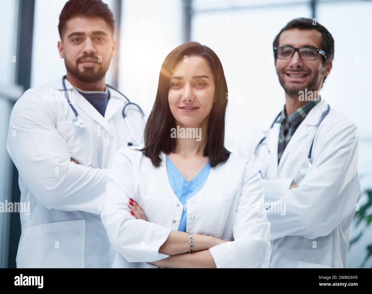 Three medical colleagues stand in the lobby of the hospital Stock Photo ...