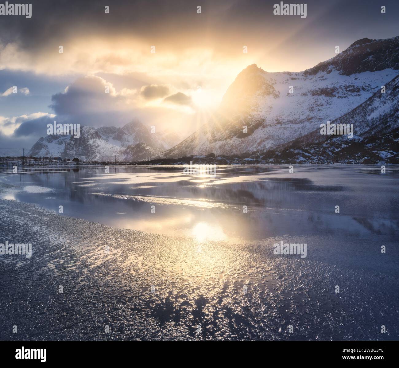 Beautiful snowy mountains and colorful sky with clouds at sunrise Stock ...