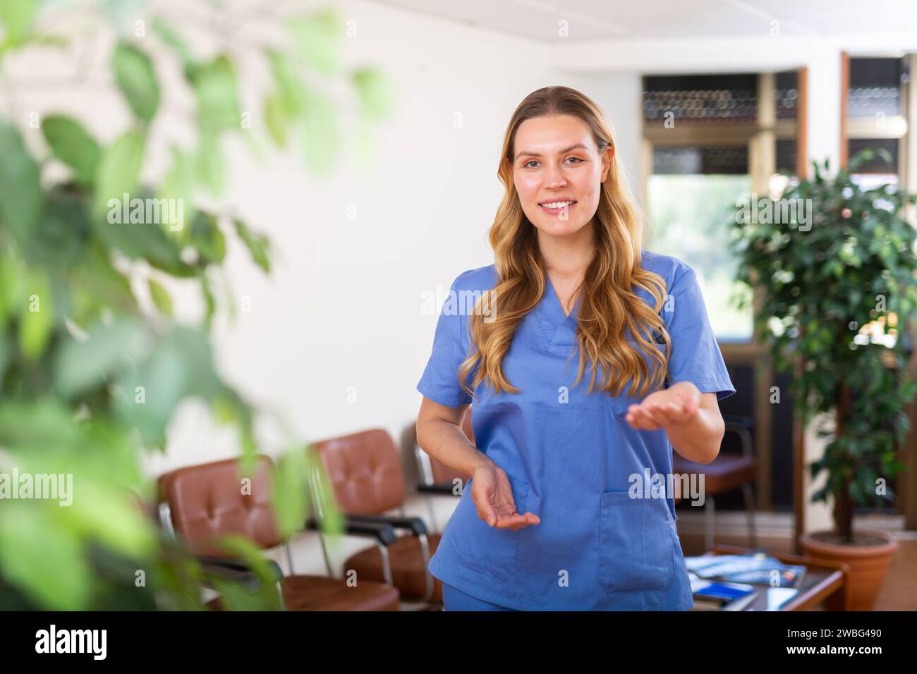 Female doctor assistant standing in medical office Stock Photo - Alamy