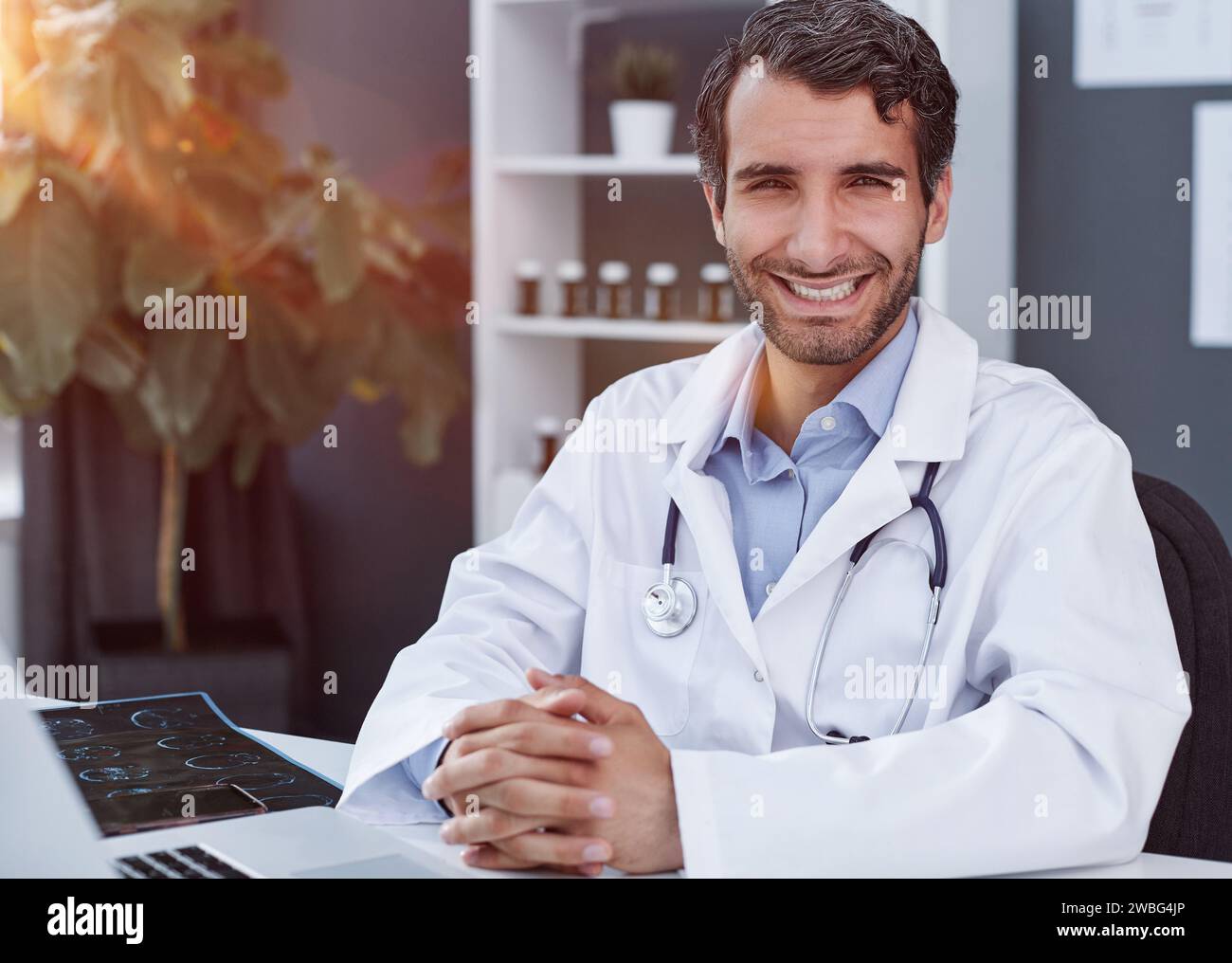 Portrait of happy arabic doctor posing at clinic Stock Photo - Alamy