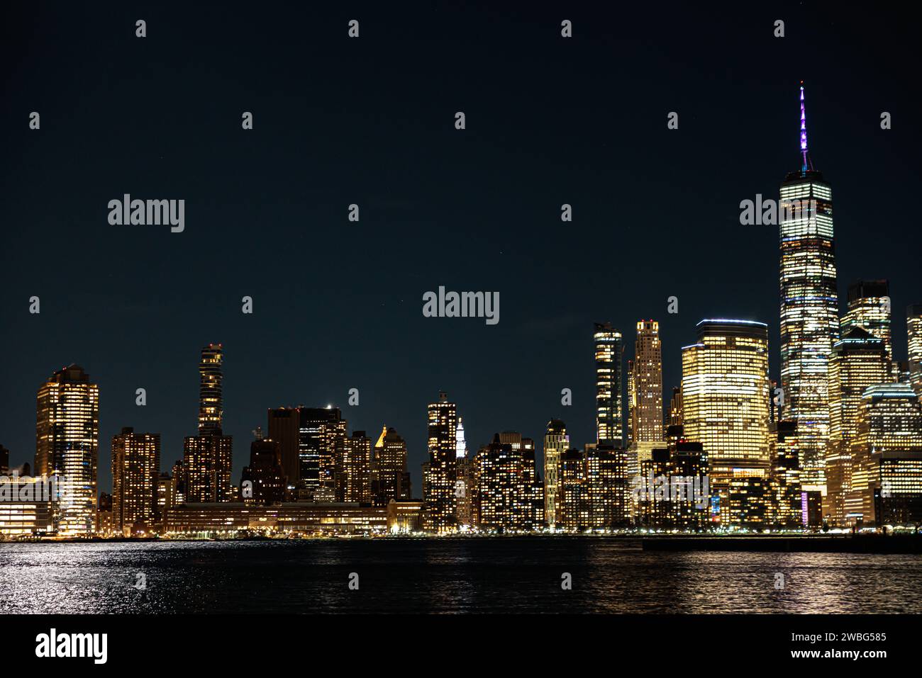 A stunning night-time aerial view of the illuminated New York City ...