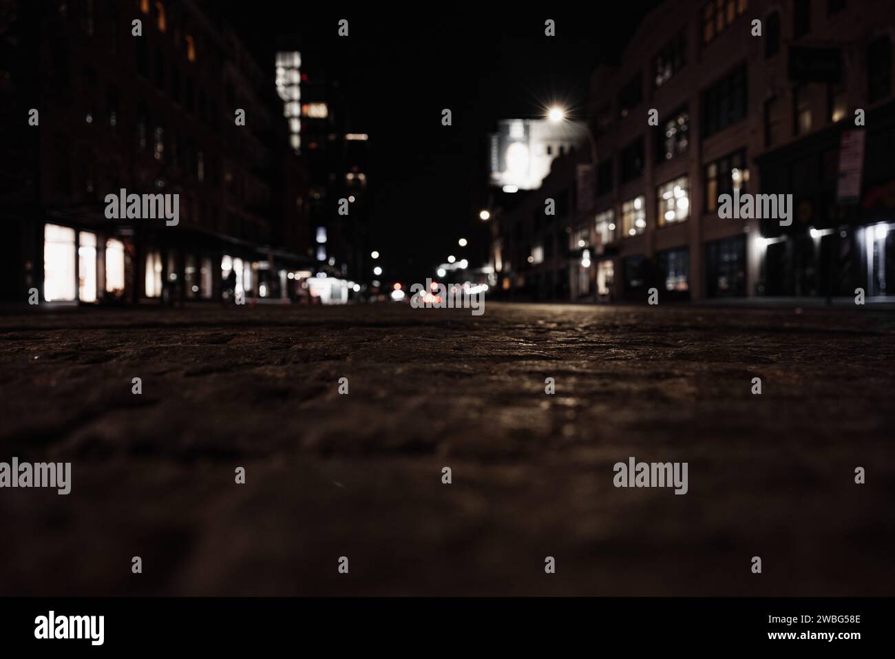 An urban cityscape featuring a dimly lit street adorned with sleek ...