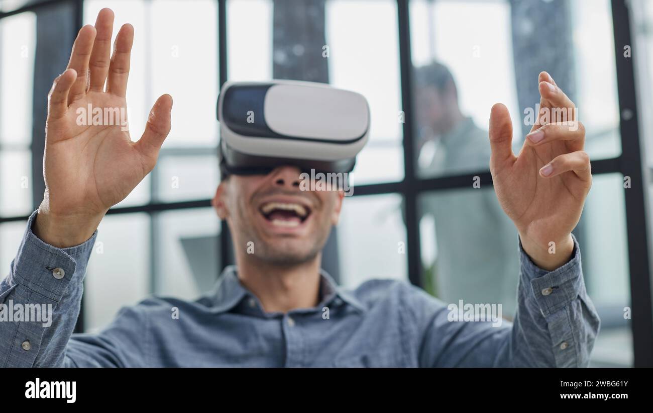 Cool handsome man put on virtual reality goggles for the first time in ...