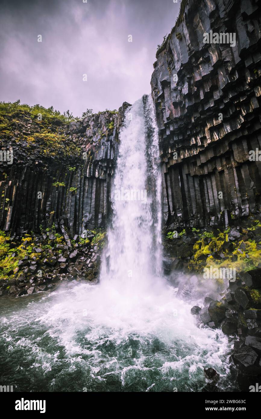 Thunderous masses of water cascade down the Skaftafell waterfall along ...