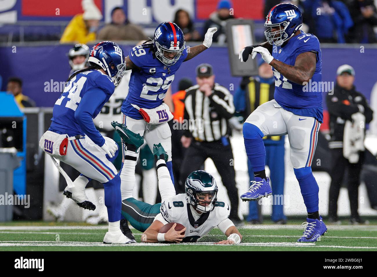 Philadelphia Eagles quarterback Marcus Mariota (8) falls to the turf in front of New York Giants ...