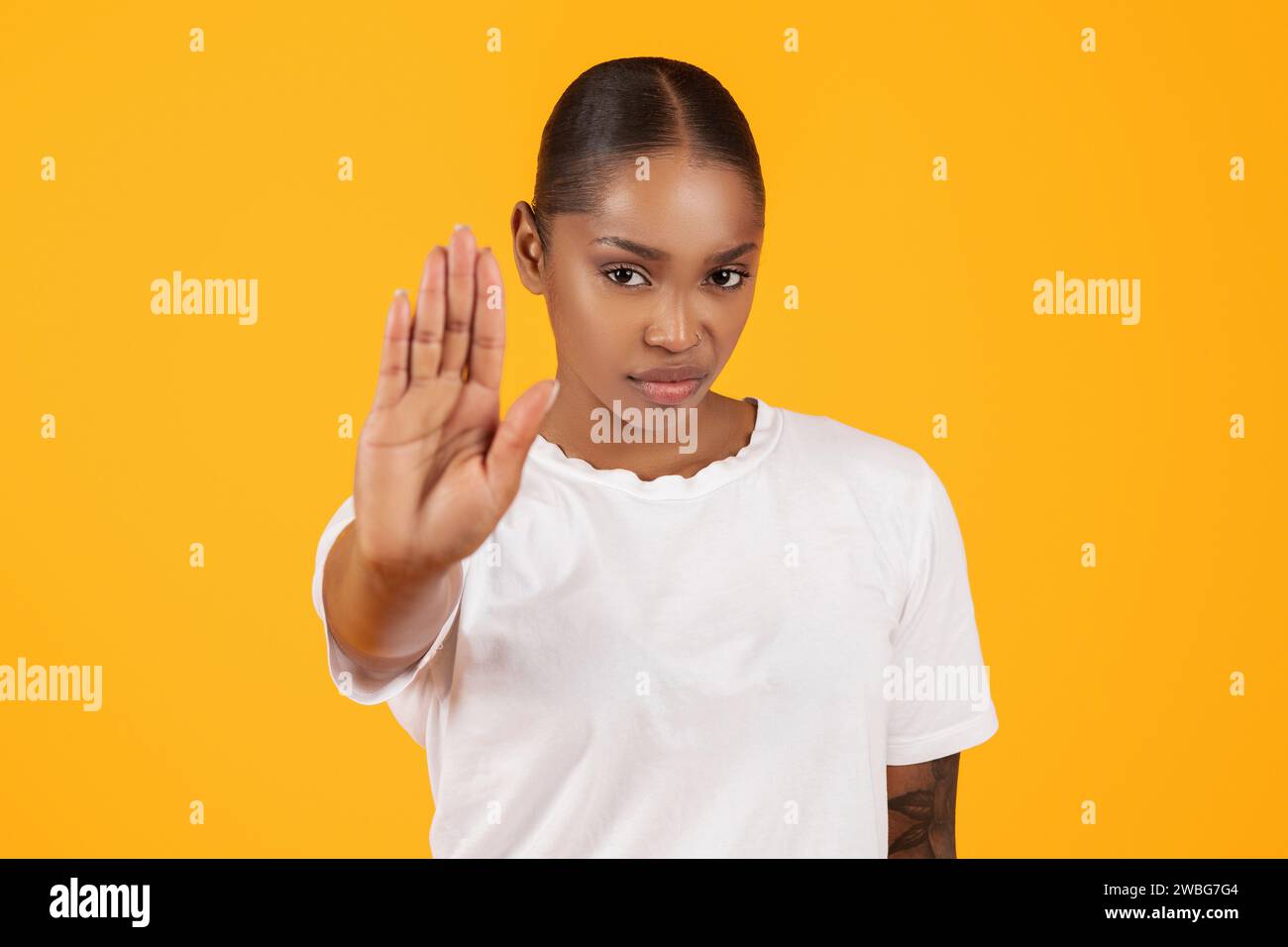 Angry young woman raising hand hi-res stock photography and images - Alamy