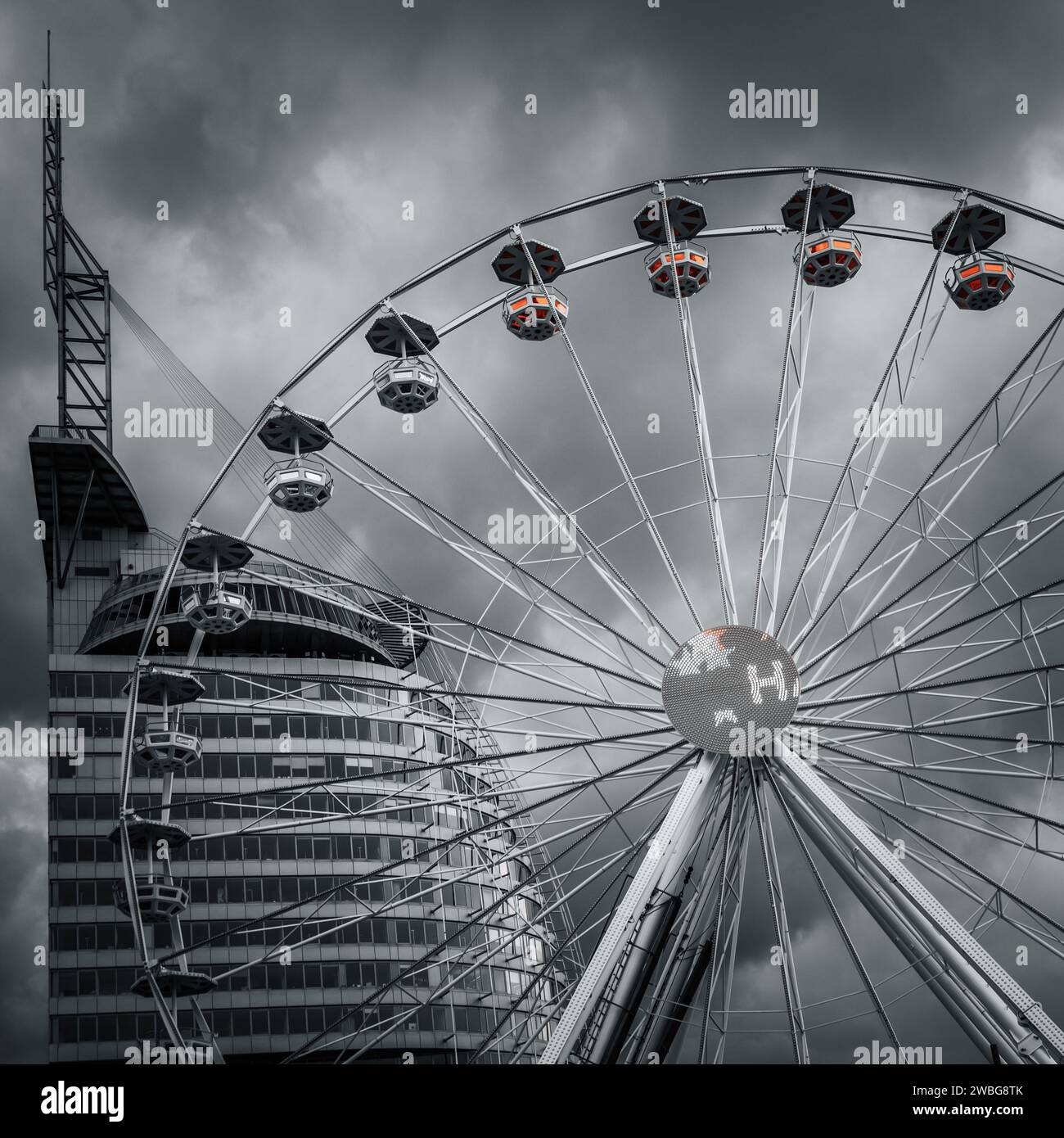 An aerial view of a vibrant and colorful ferris wheel situated against ...