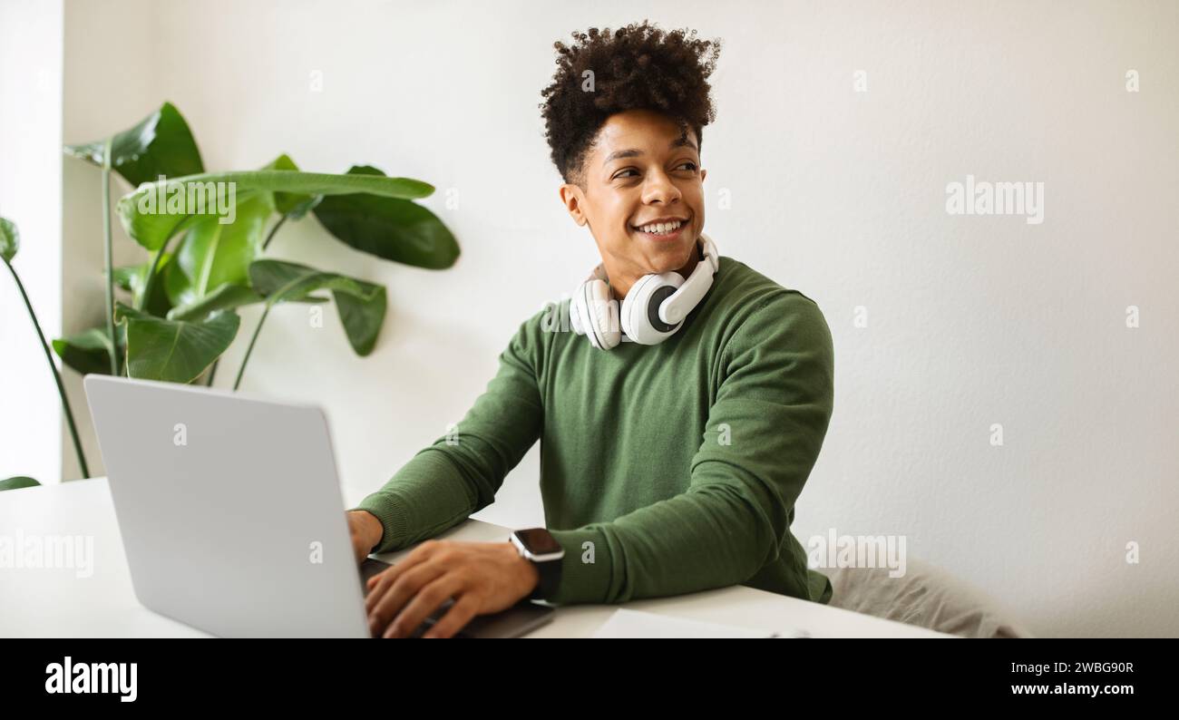 Happy black guy independent contractor working from cafe Stock Photo ...