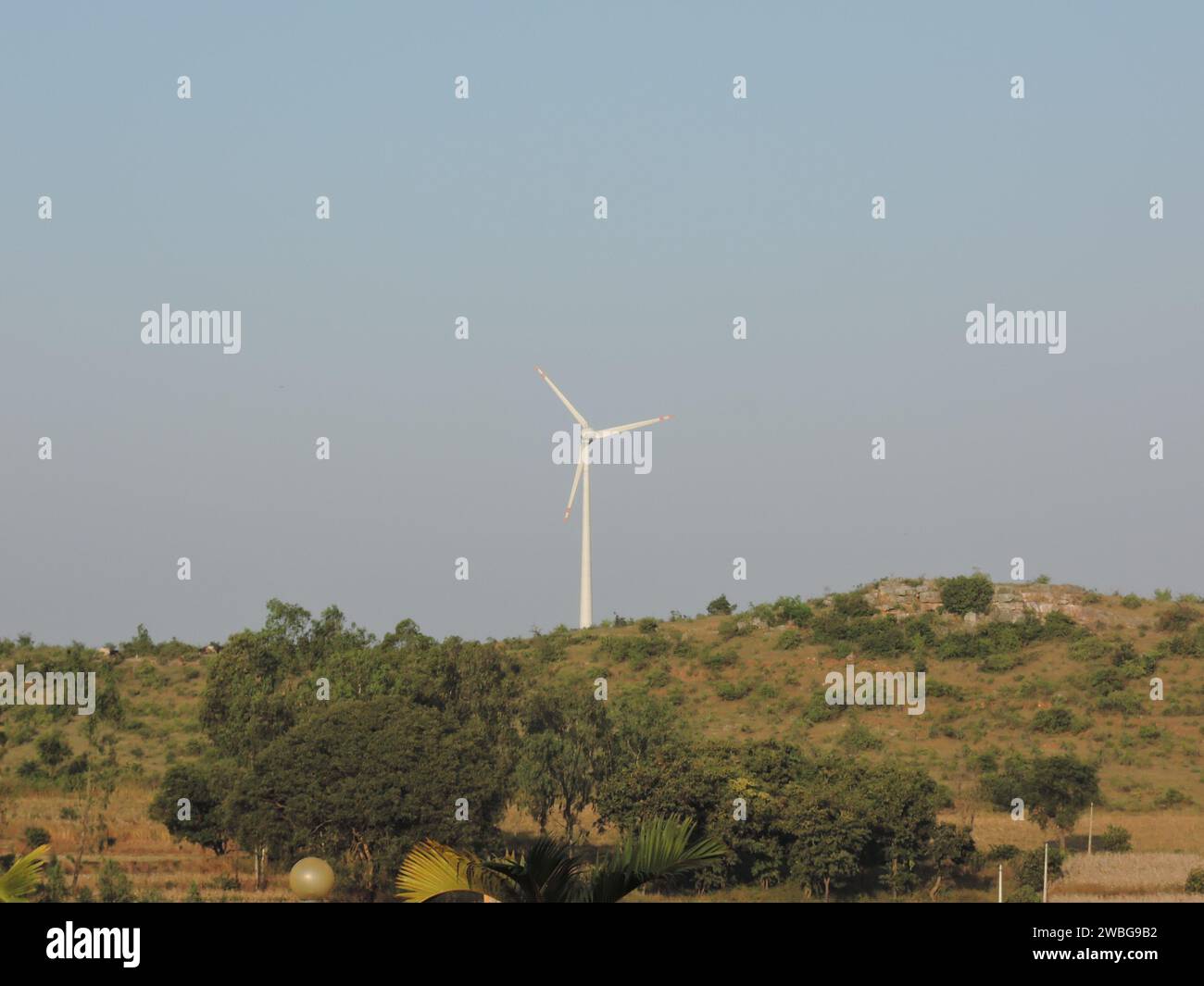 A windmill on top of a hill in rural Karnataka, India Stock Photo - Alamy
