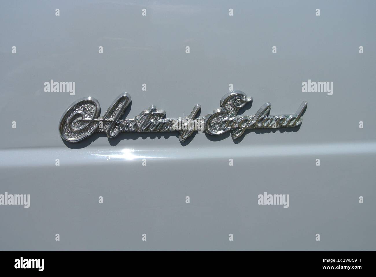 A Austins of England vehicle badge on a 1960 Austin A55 van parked on ...