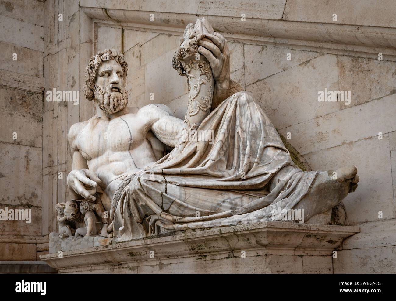 The ancient statue of Tiberinus, holding a cornucopia, in front of ...
