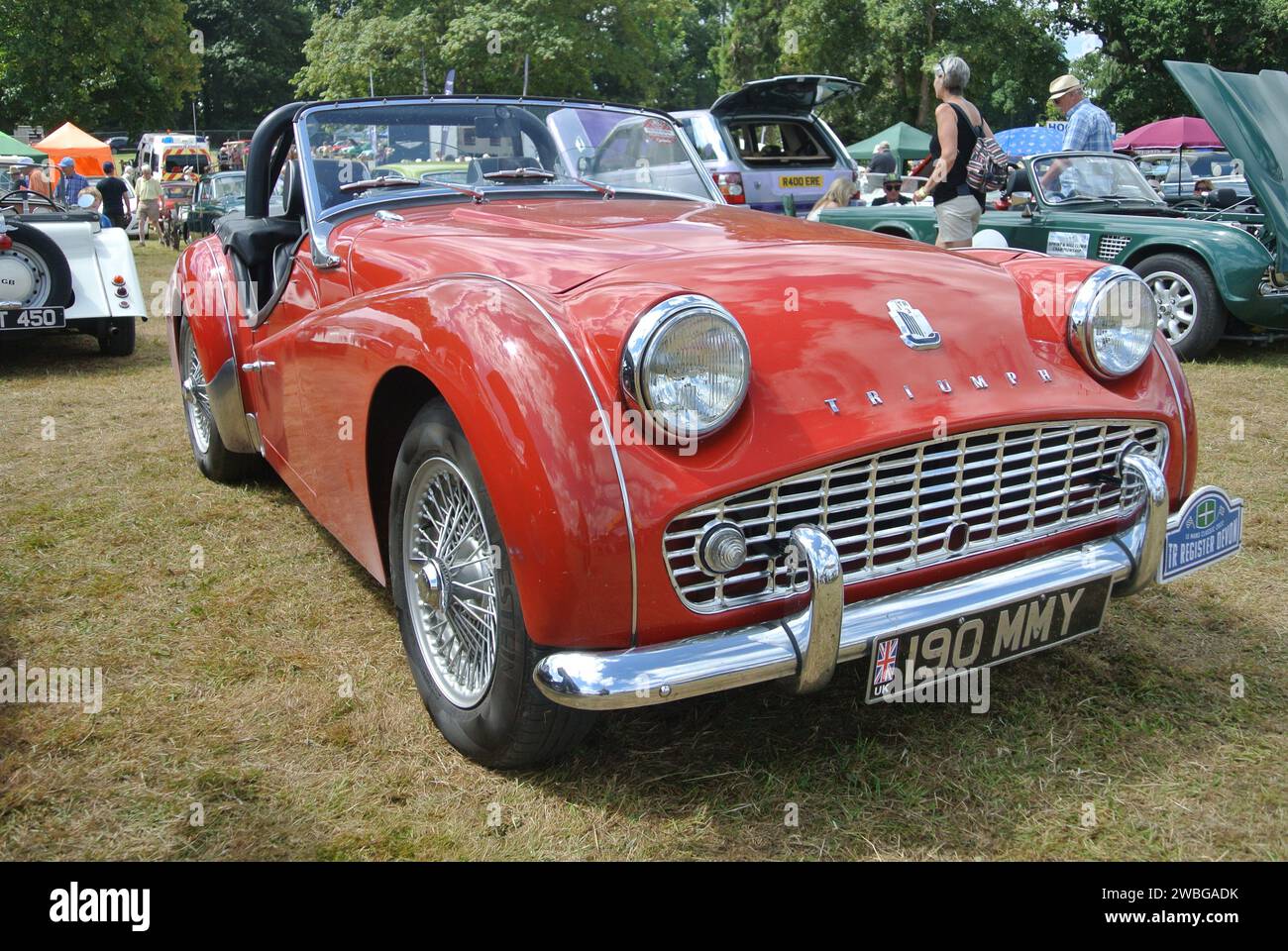 A 1957 Triumph TR3 convertible sports car parked on display at the 47th ...