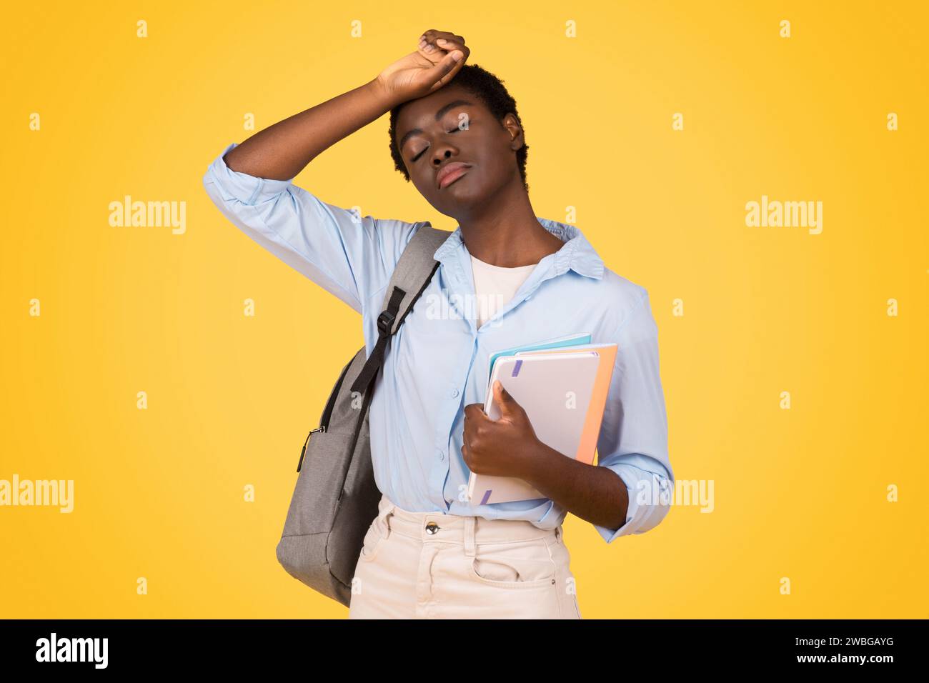 A black woman student, visibly tired and sweating, depicts exhaustion ...