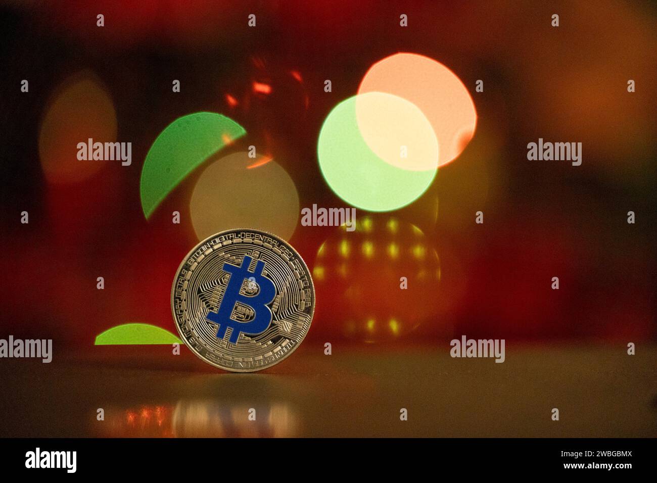 Digital currency physical metal bitcoin coin with abstract bokeh light ...