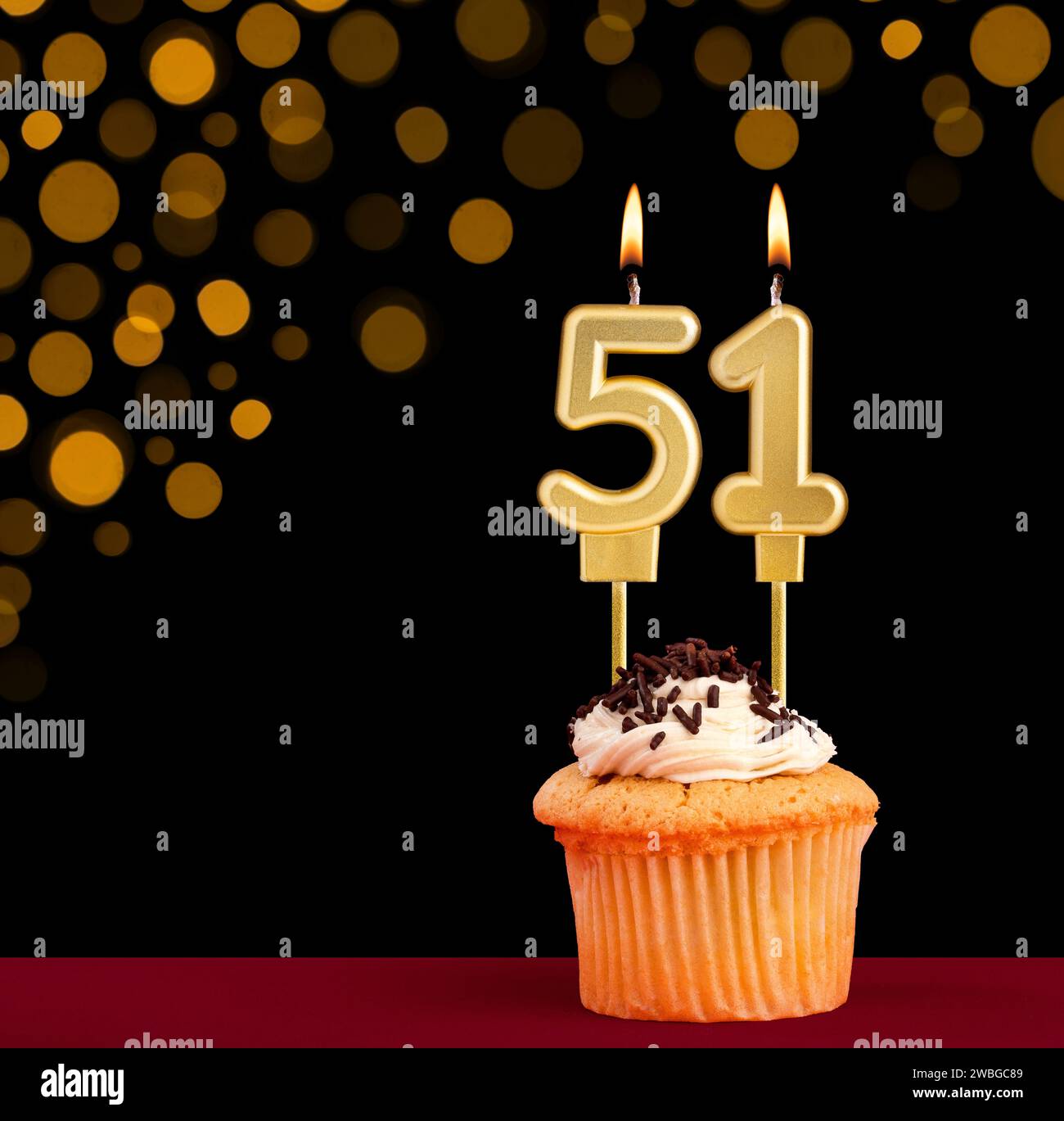 Number 51 birthday candle - Cupcake on black background with out of ...
