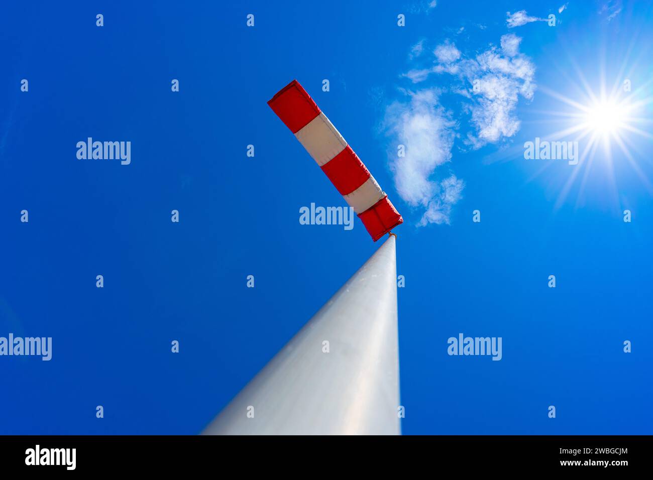 windsock in operation with strong blue sky background with sun Stock ...