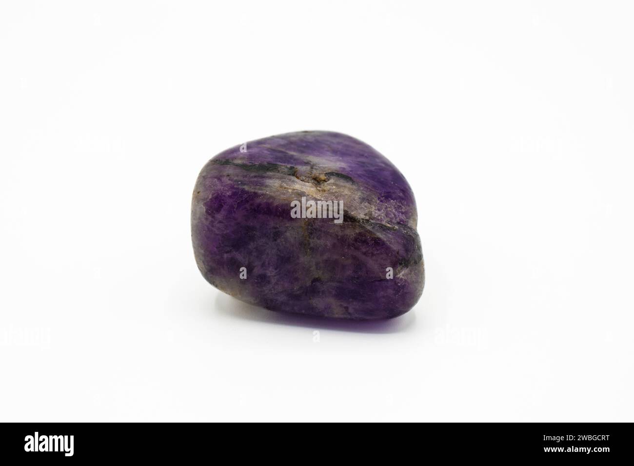 Purple amethyst stone on white background Stock Photo - Alamy