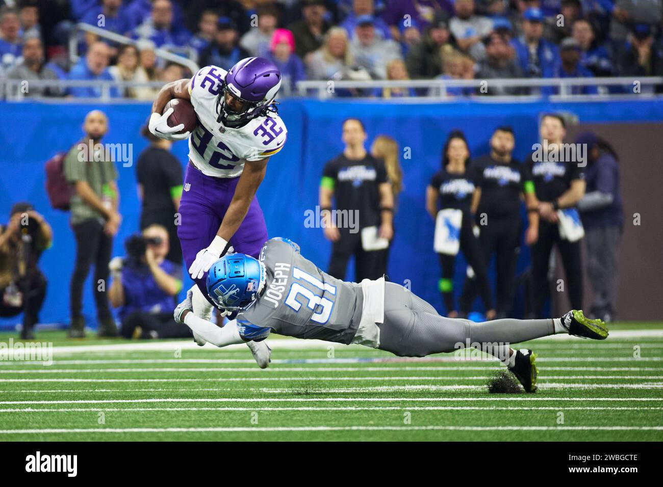 Minnesota Vikings running back Ty Chandler (32) is tackled by Detroit ...