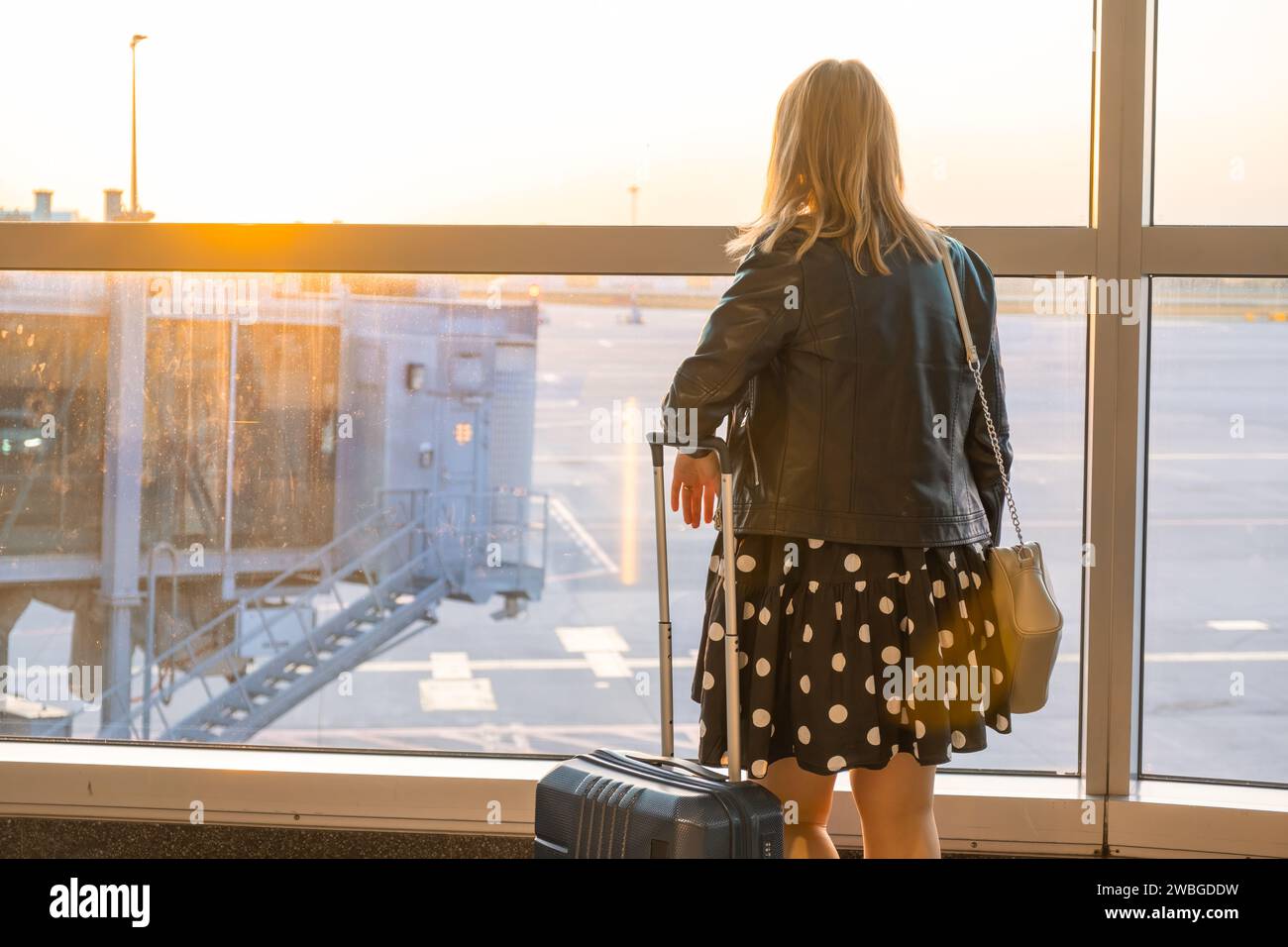 Woman airport waiting boarding hi-res stock photography and images - Alamy