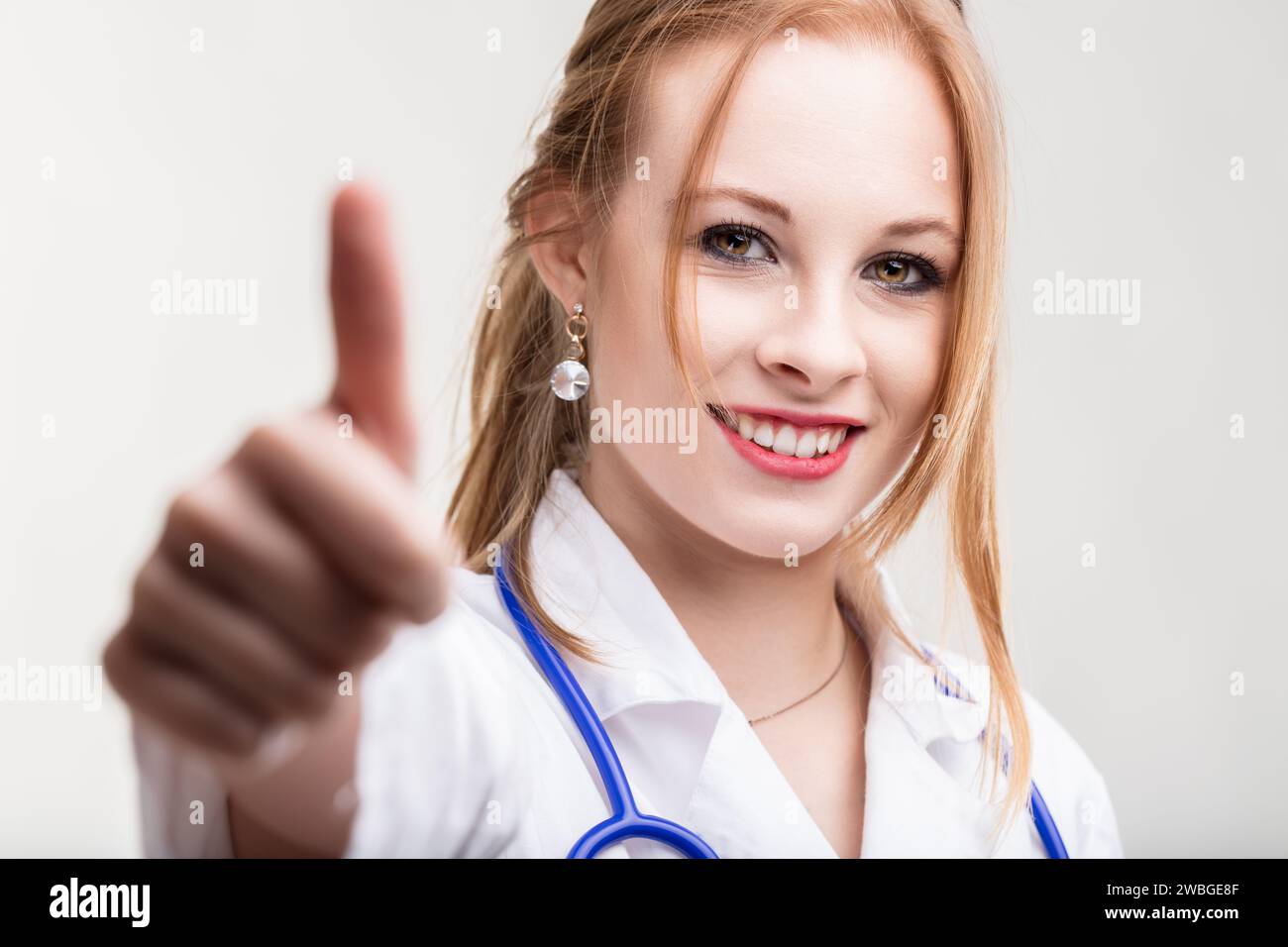 Encouraging sign from a medical practitioner, radiating cheerfulness ...