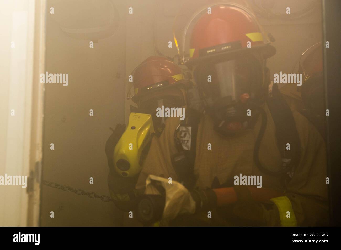 Sailors assigned to USS Boxer (LHD 4) respond to a simulated fire ...
