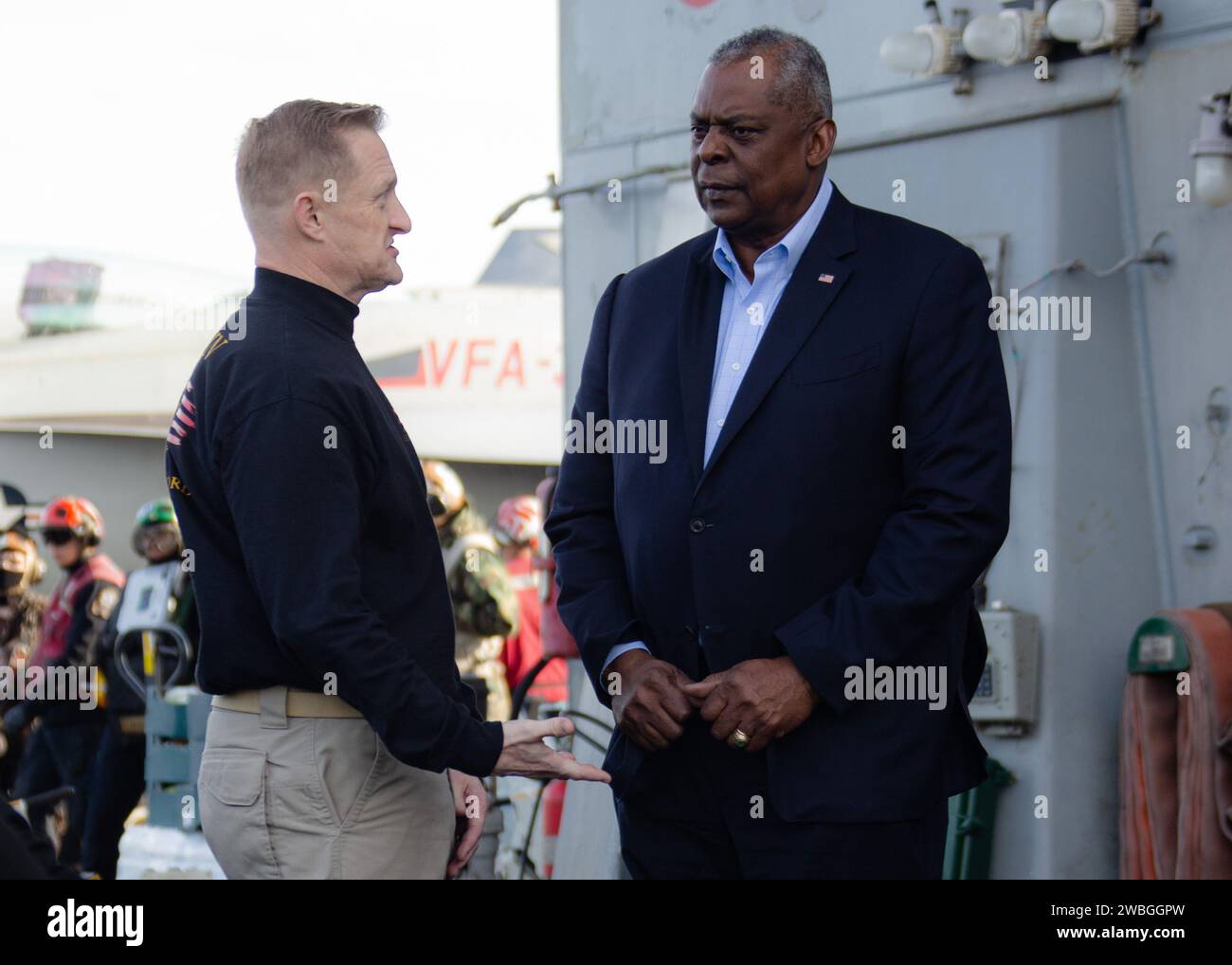 U.S. Secretary of Defense Lloyd J. Austin III, left, speaks with Capt ...