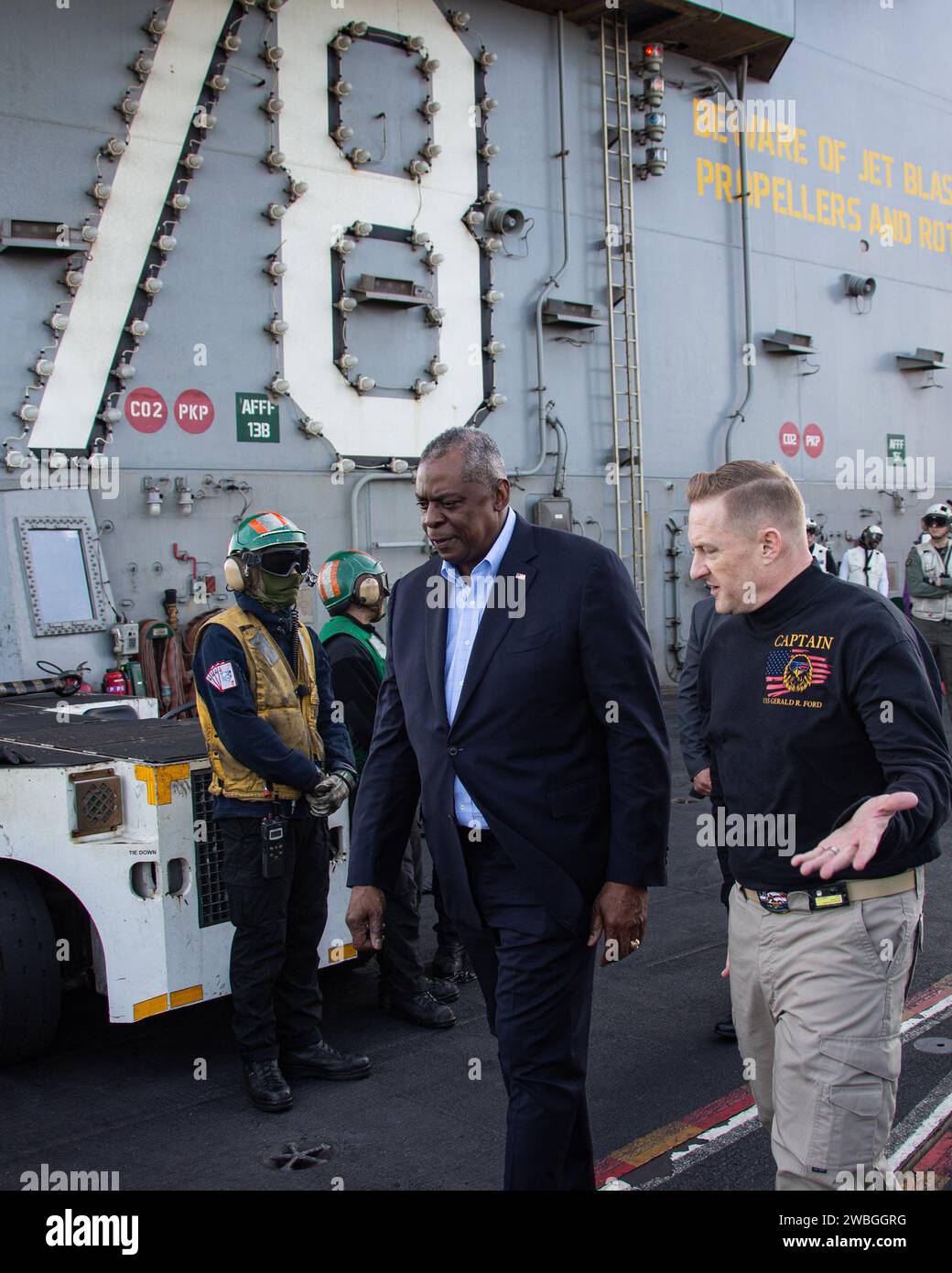 U.S. Secretary of Defense Lloyd J. Austin III, center, tours the flight ...
