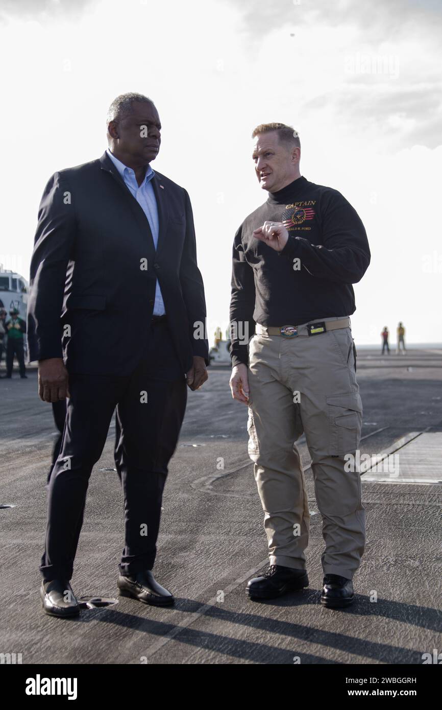U.S. Secretary of Defense Lloyd J. Austin III, left, speaks with Capt ...
