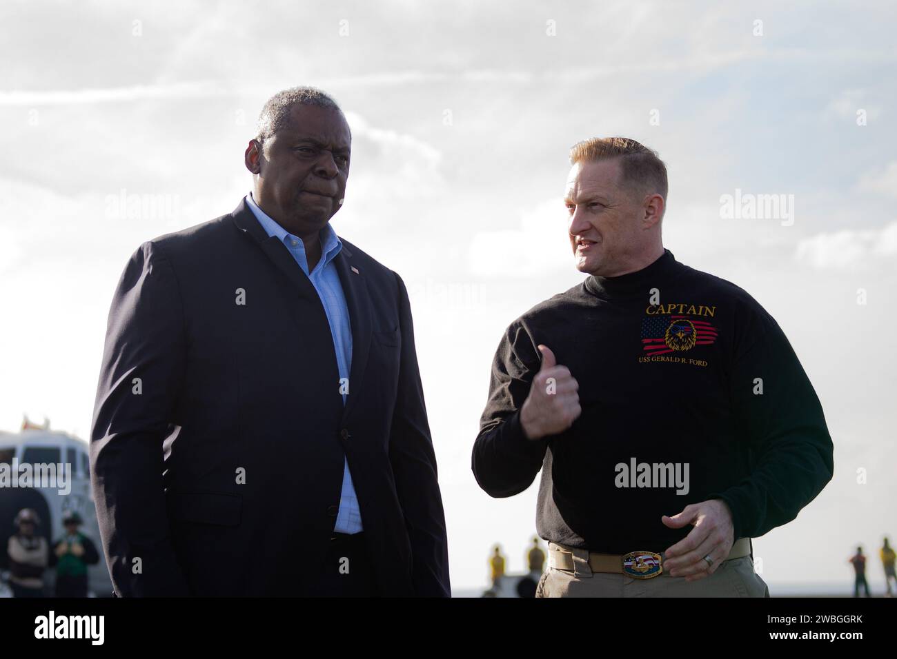 U.S. Secretary of Defense Lloyd J. Austin III, left, speaks with Capt ...